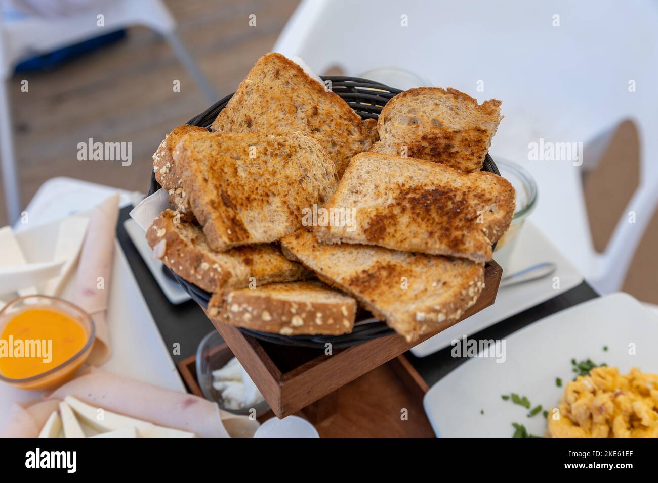 A selective focus shot of toasted bread basket on a wooden stand Stock ...