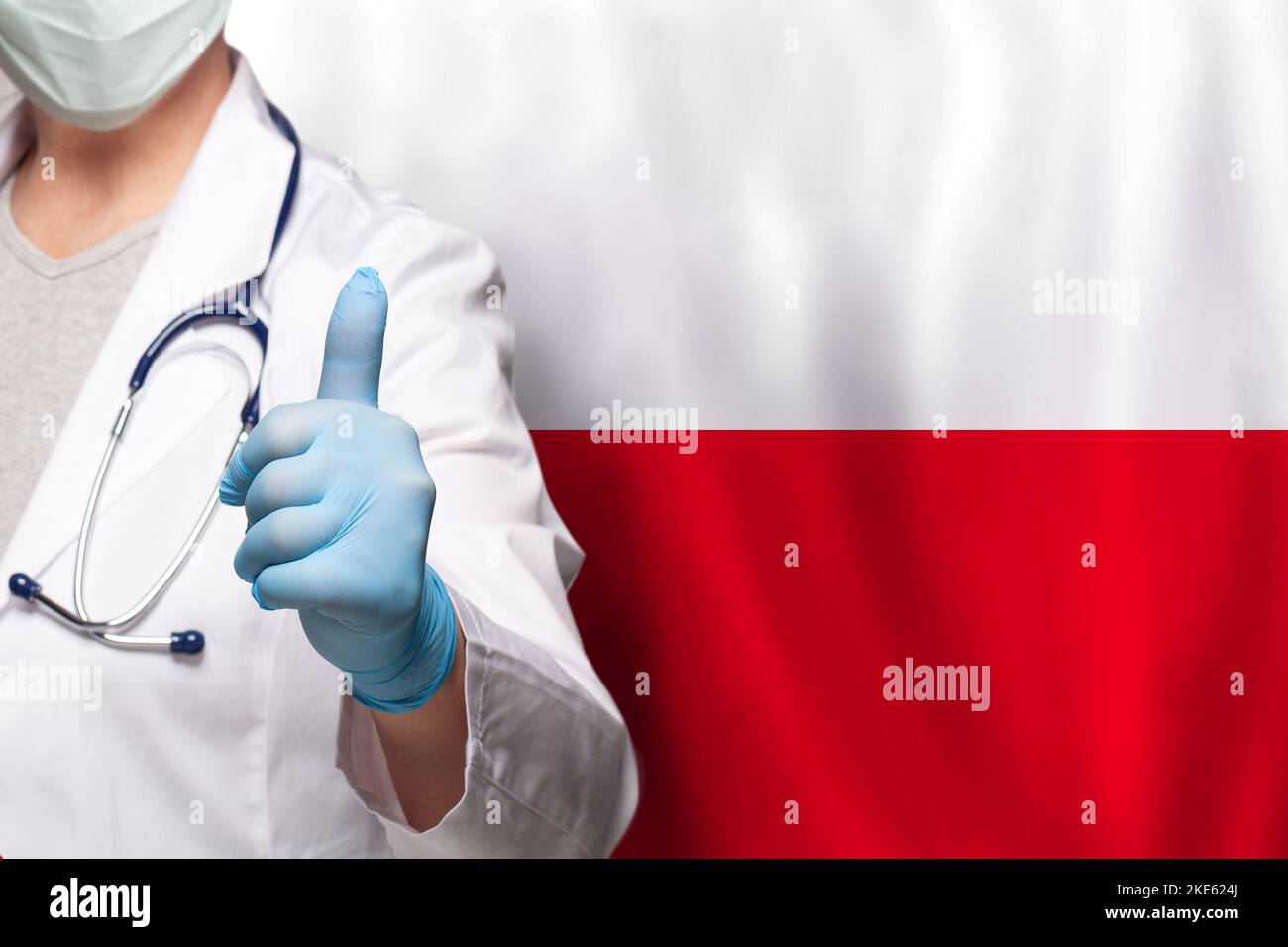 Polish doctor's hand showing thumb up positive gesture on flag of ...