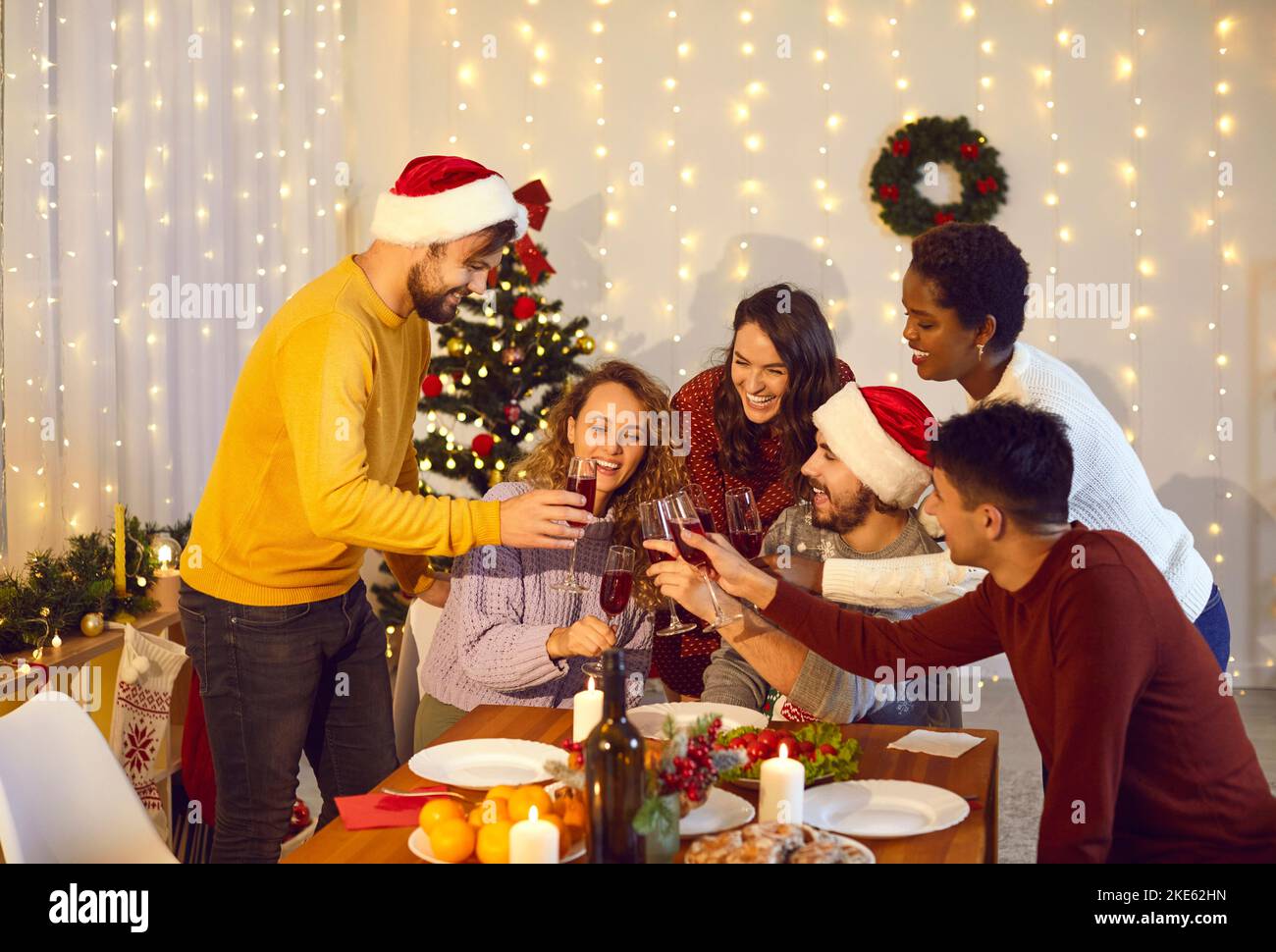 Smiling diverse friends cheers celebrating New Year Stock Photo - Alamy