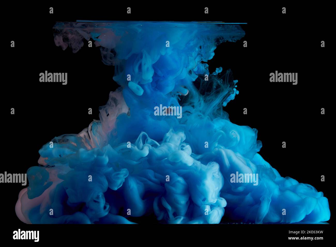 Abstract acrylic paint color swirls in water, black background ...