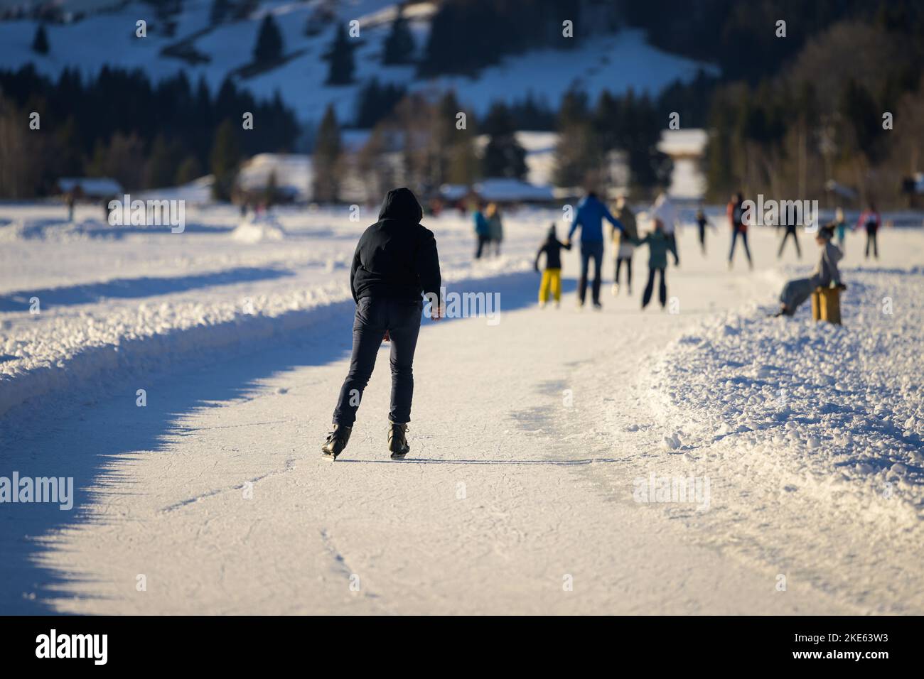 Ice skating on lake lake weissensee hi-res stock photography and images ...