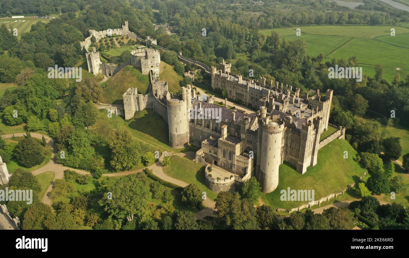 An aerial view of mesmerizing Arundel castle surrounded by green trees ...