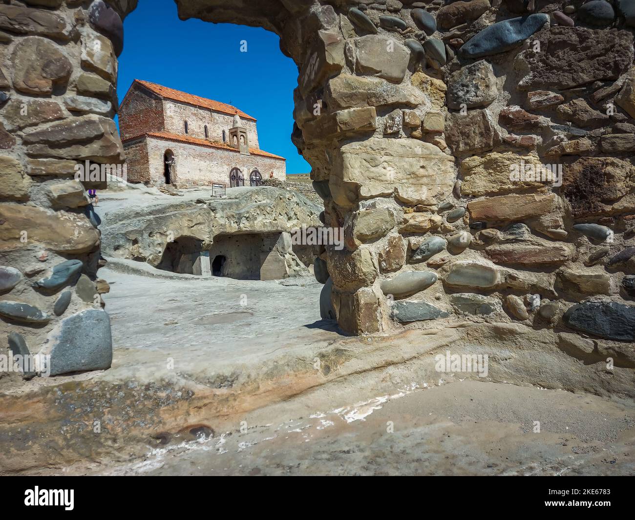 A view of the basilica through a passageway at the ancient Uplistsikhe ...