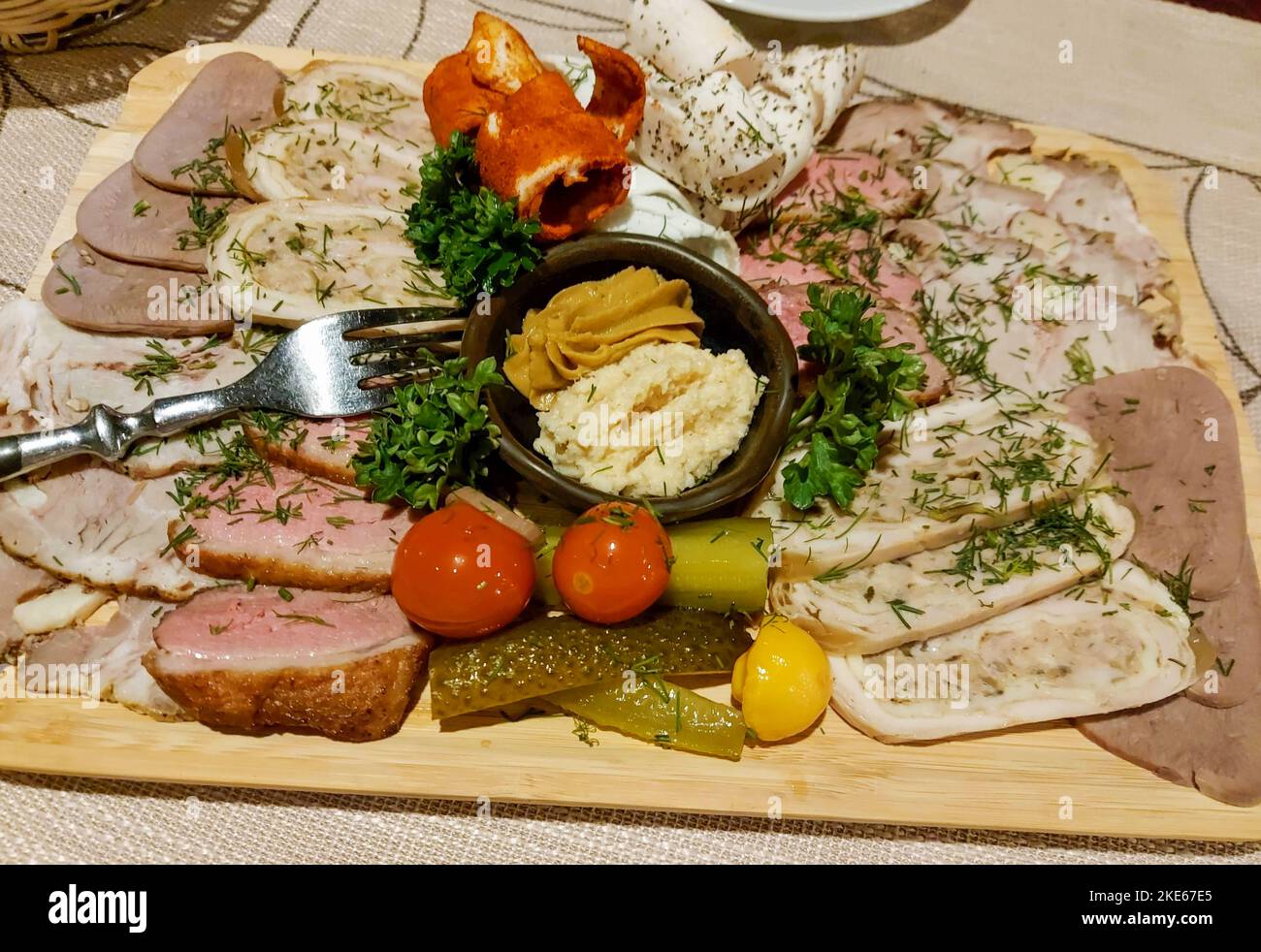 Meats on the table, lard and pickled cucumbers. Polish food, cold ...