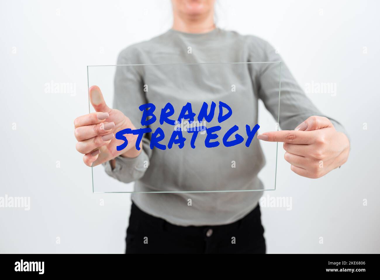 Hand writing sign Brand Strategy. Internet Concept longterm plan ...