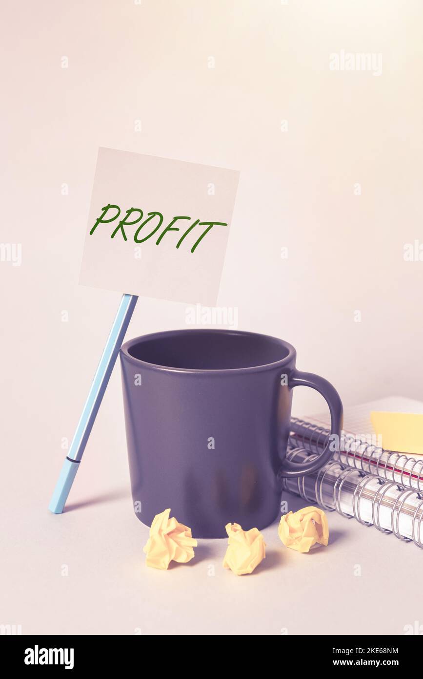Hand writing sign Profit. Business approach the difference between the ...