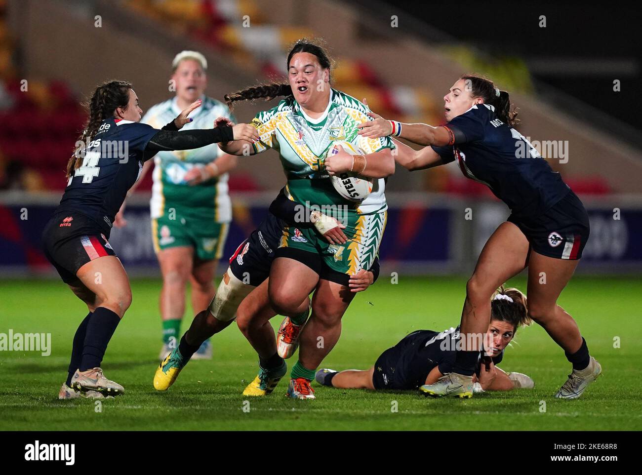 Cook Islands' Terehia Matua tackled by France's Fanny Ramos and Perinne ...