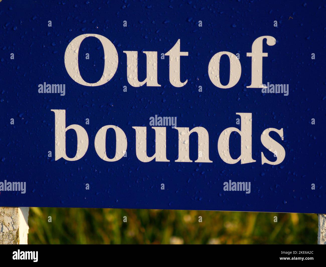 Out of bounds sign on golf course bold white lettering on royal blue ...
