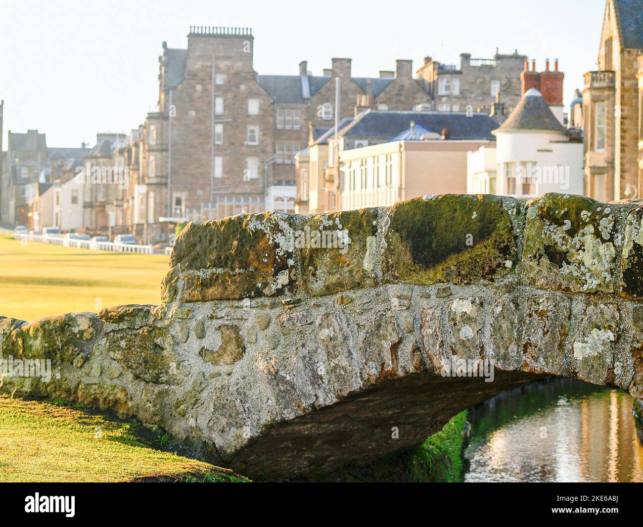 Small picturesque stone arch bridge over creek Stock Photo - Alamy