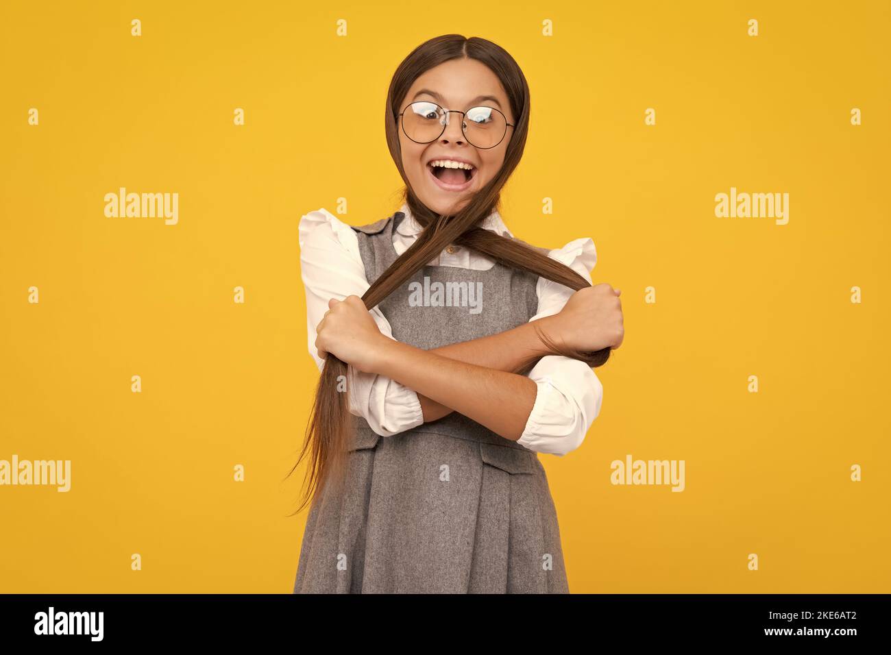 Studio shot of emotional adorable little girl surprised and shocked ...