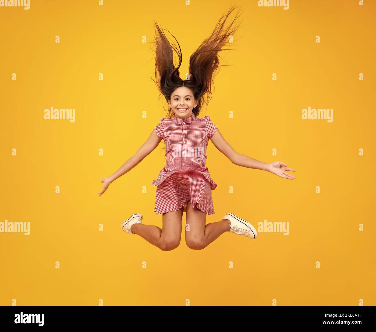 Amazed teen girl. Full size photo of positive teen girl jump with ...