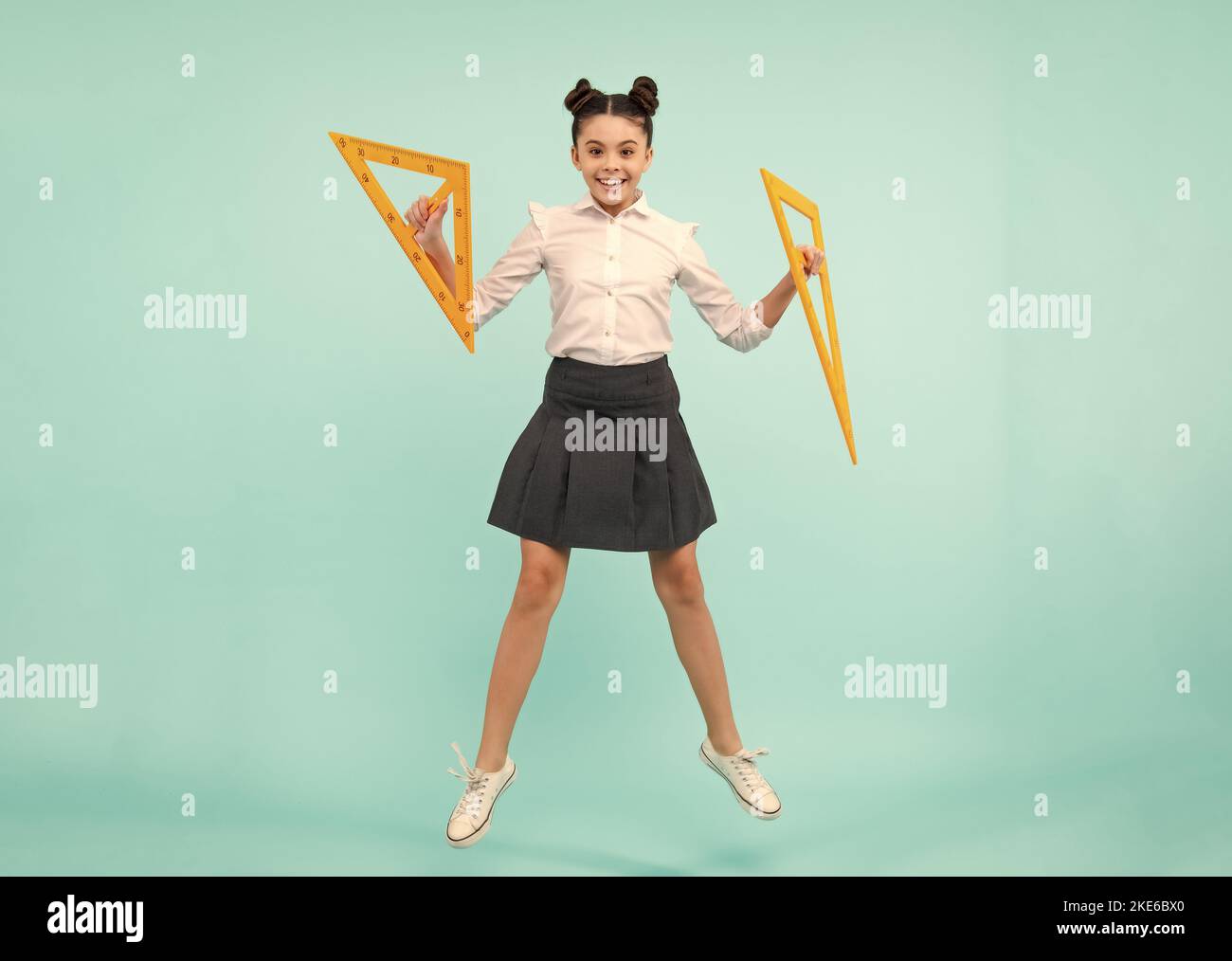 Teenager child school girl holding measure for geometry lesson ...