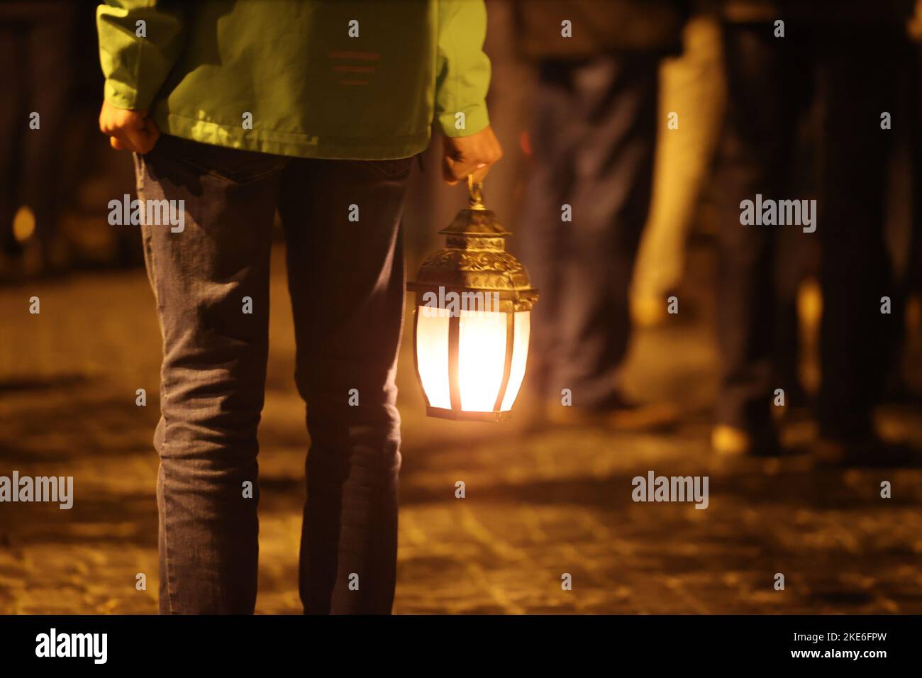 Erfurt, Germany. 10th Nov, 2022. People with lanterns stand in the ...