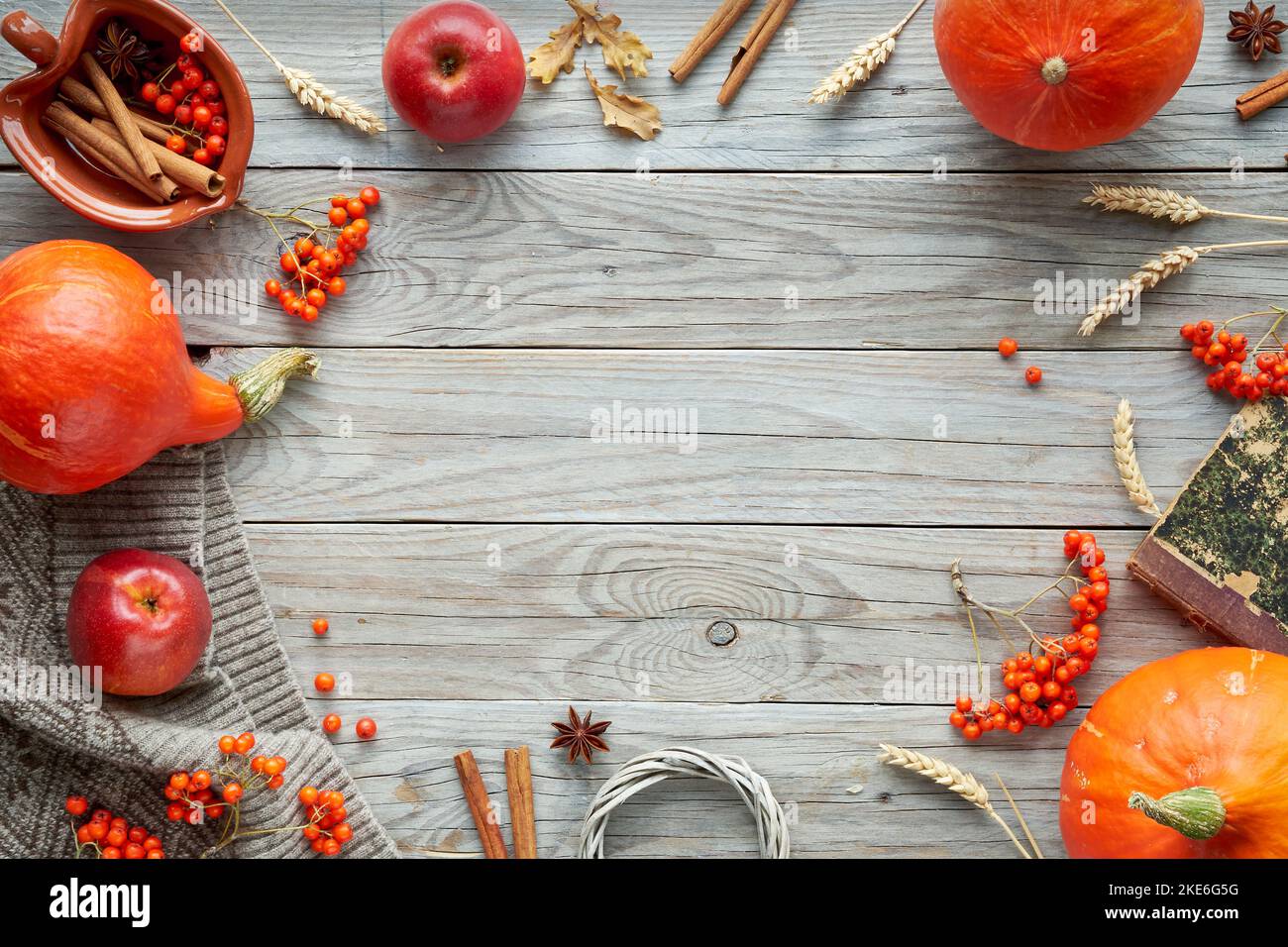 Frame made with orange Hokkaido pumpkins, rowan berry, apples, cinnamon ...