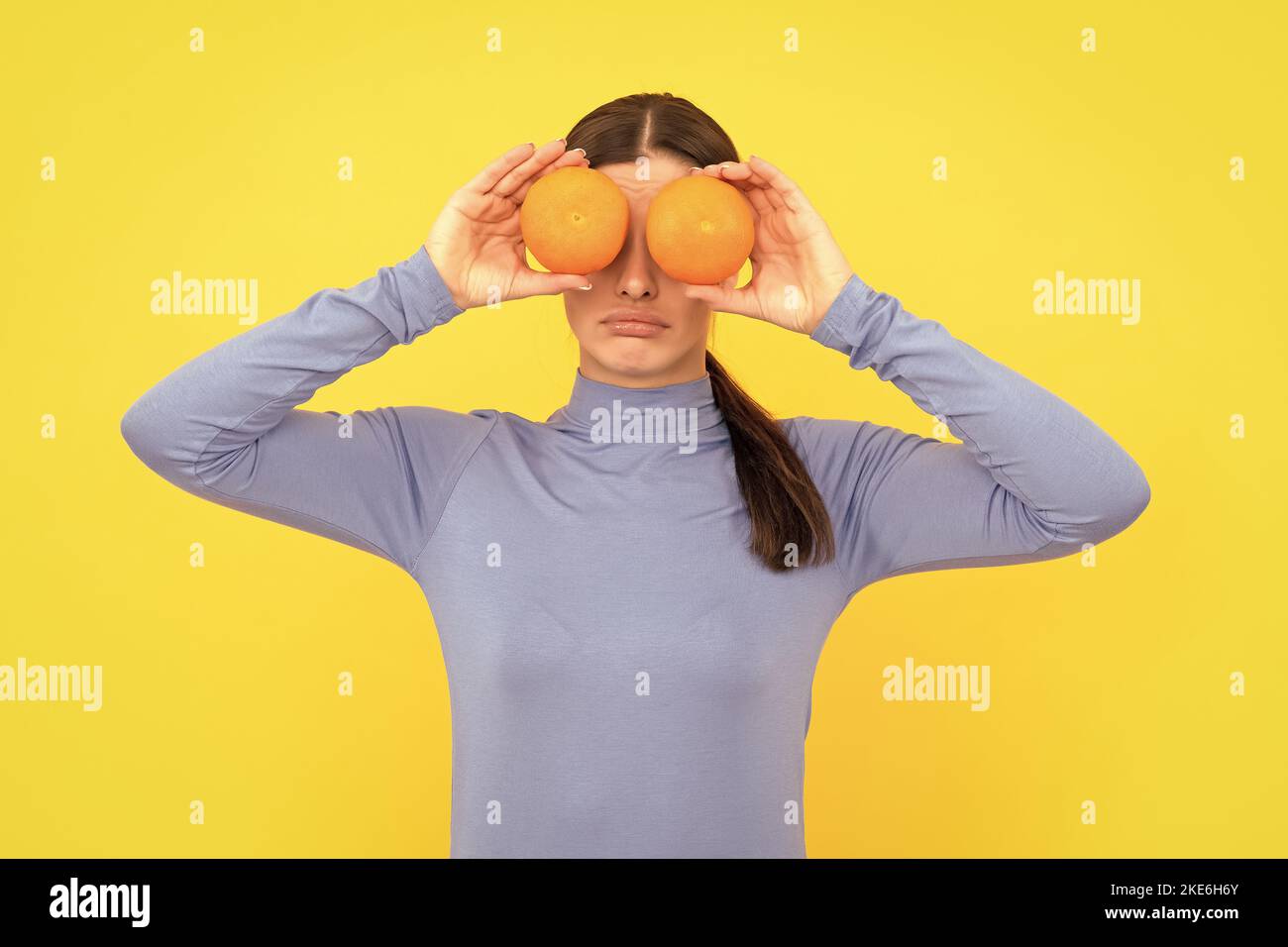 funny girl with orange citrus fruit. vitamin and dieting. woman holding ...