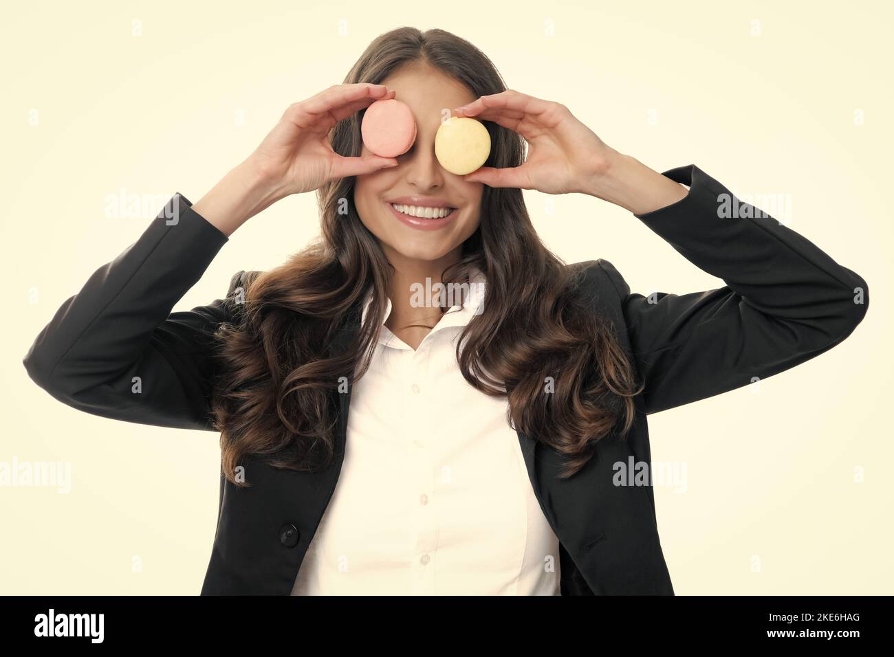 Funny woman hold two cake in front of eyes. Hipster girl. Cute young ...
