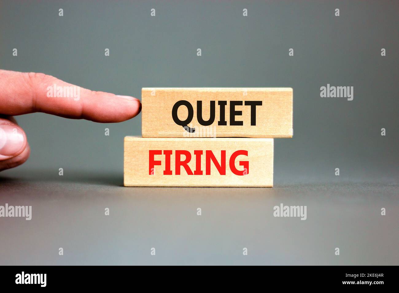 Quiet firing symbol. Concept words Quiet firing on wooden blocks ...