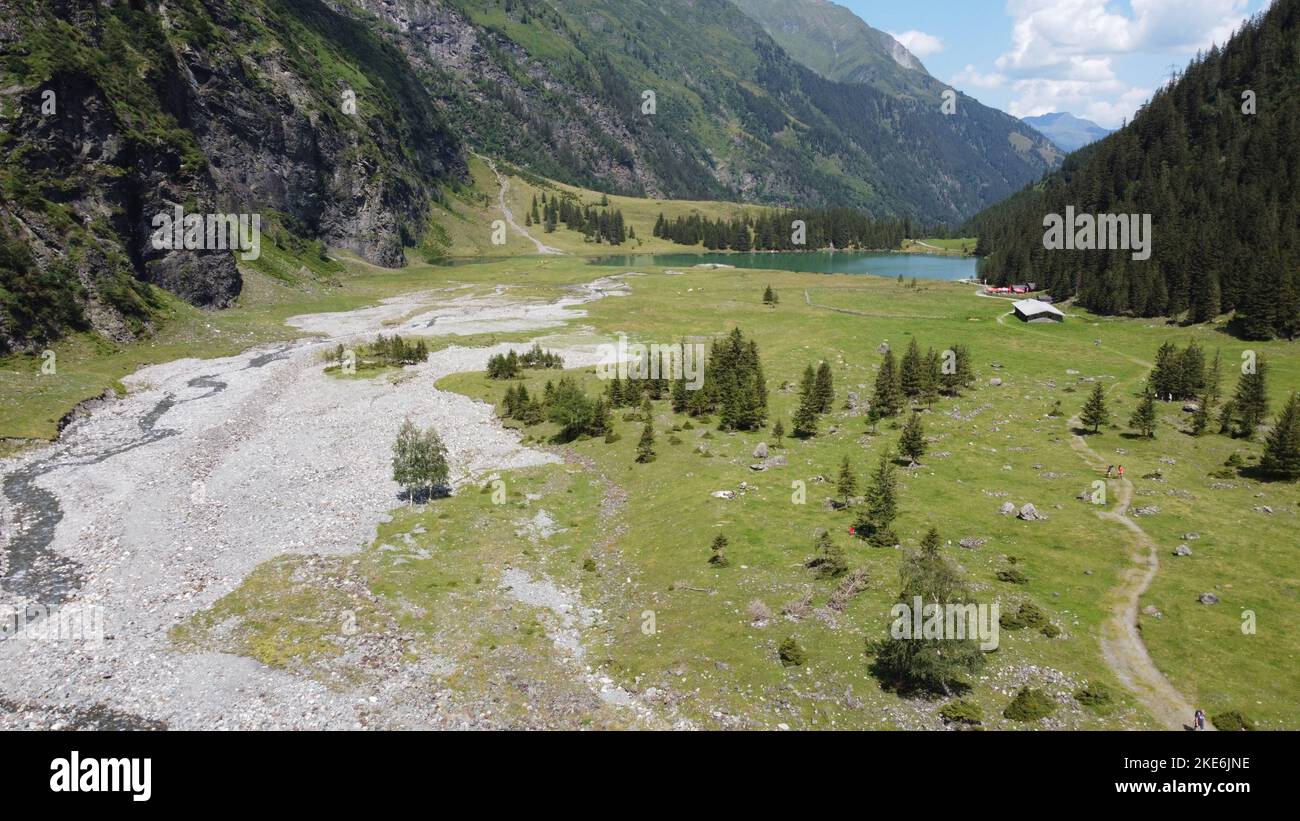 A Beautiful mountainous landscape with green grass on a sunny day Stock ...