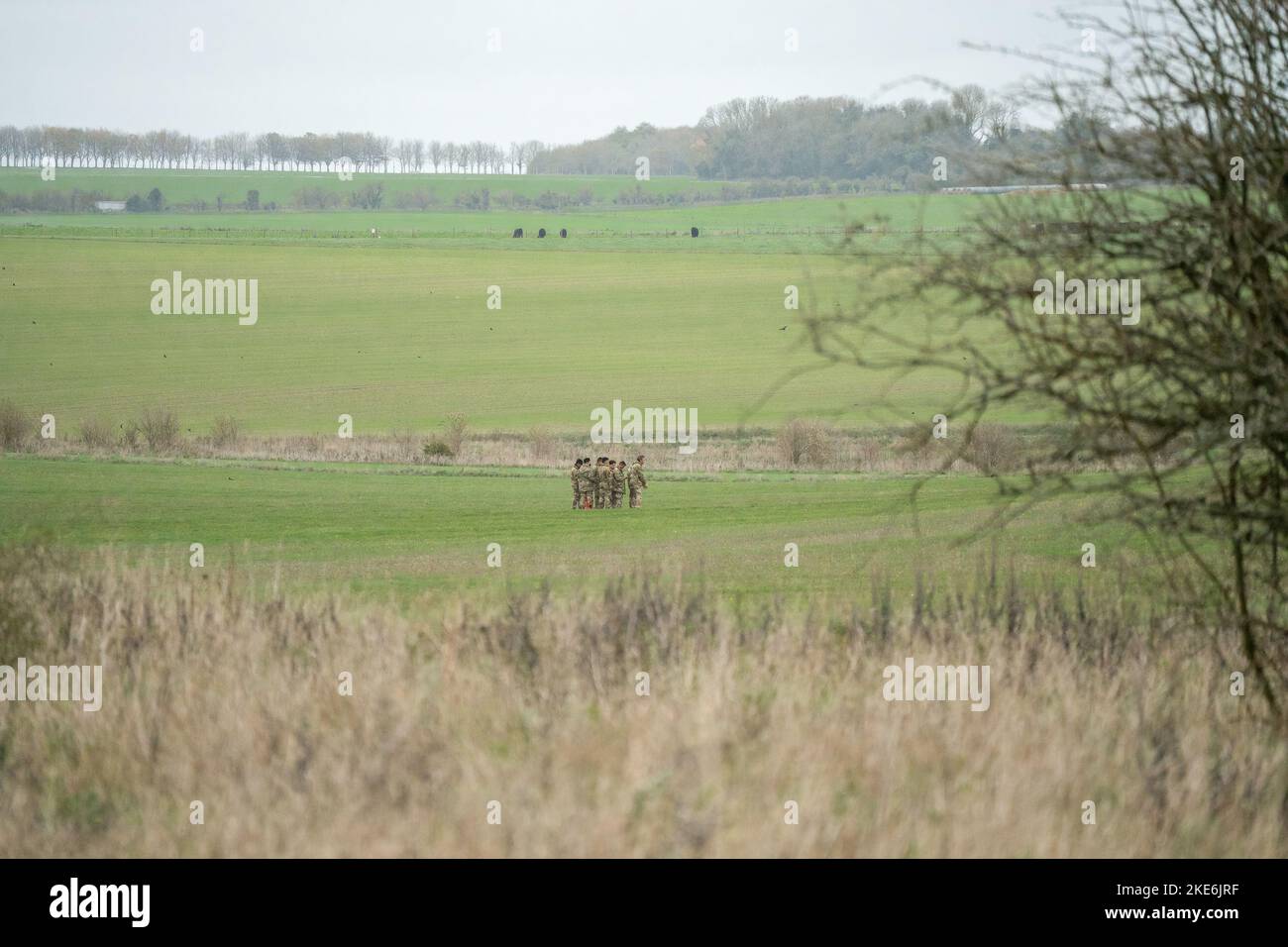 group of soldiers stood planning action in a field Stock Photo - Alamy