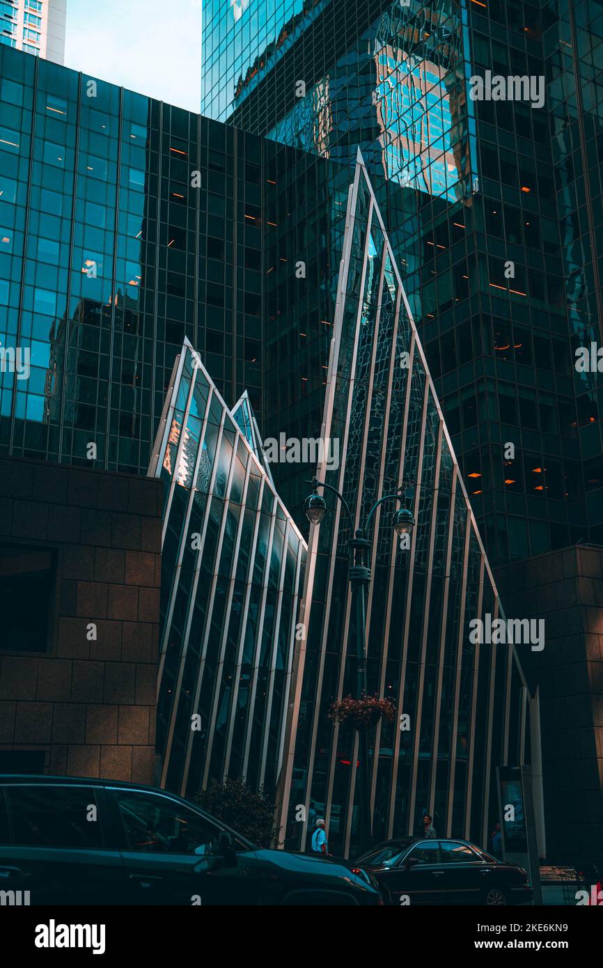 A vertical shot of a modern glass building with a cool design Stock ...