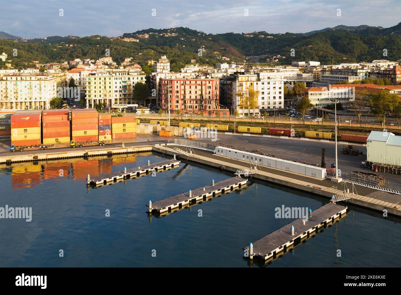 Stacked shipping containers on dock in commercial port of La Spezia and ...