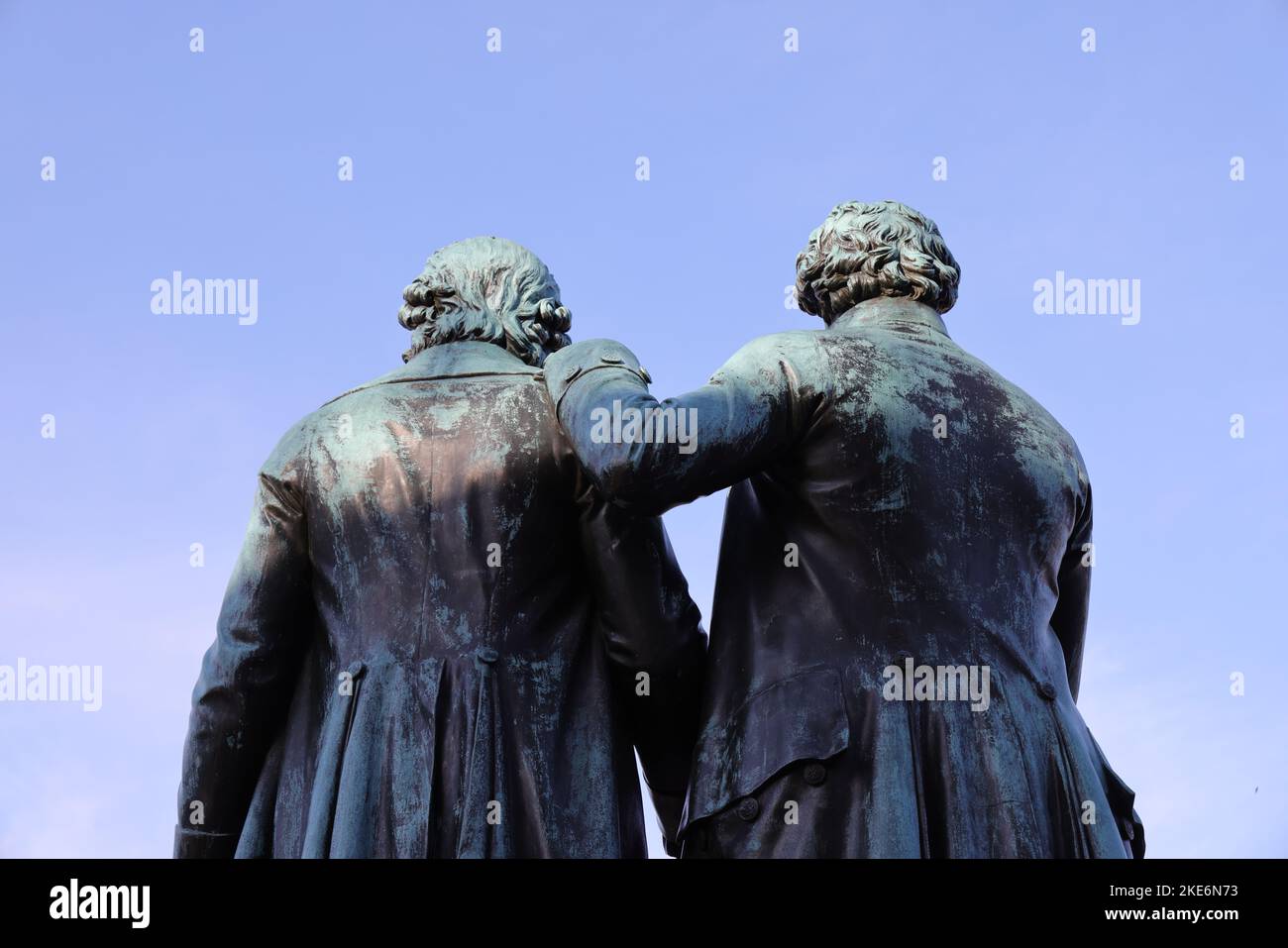 A back view of Goethe-Schiller-Denkmal monument on blue cloudy sky ...