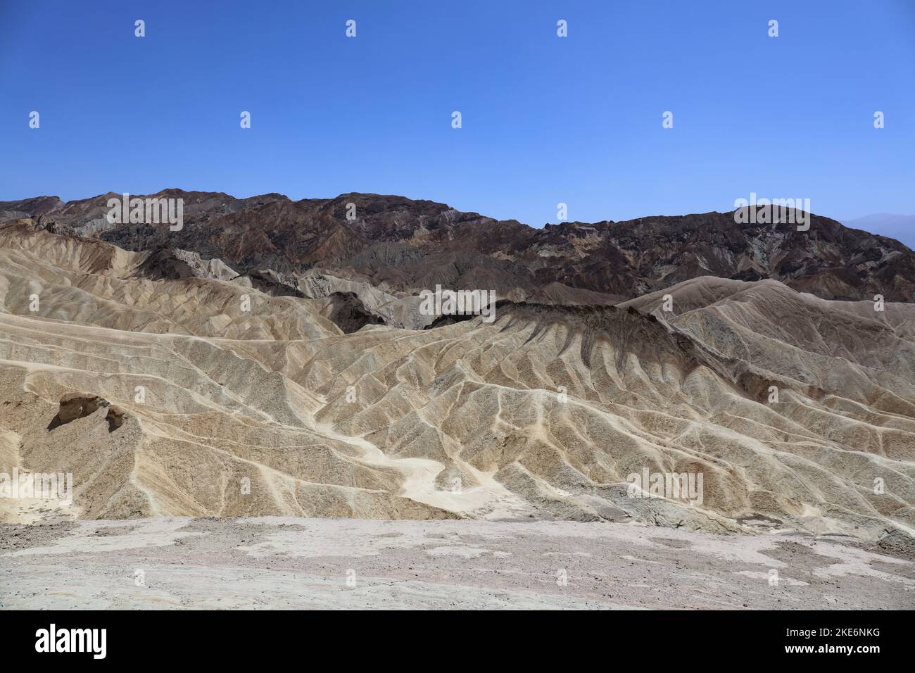 The undulating, barren, desolate mountain landscape at the Zabriskie Point Lookout in Death ...