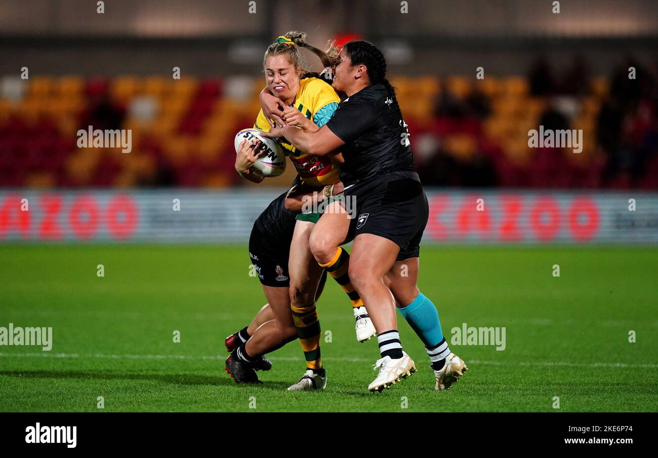 Australia's Kezie Apps is tackled by New Zealand's Annetta Nu'uausala ...
