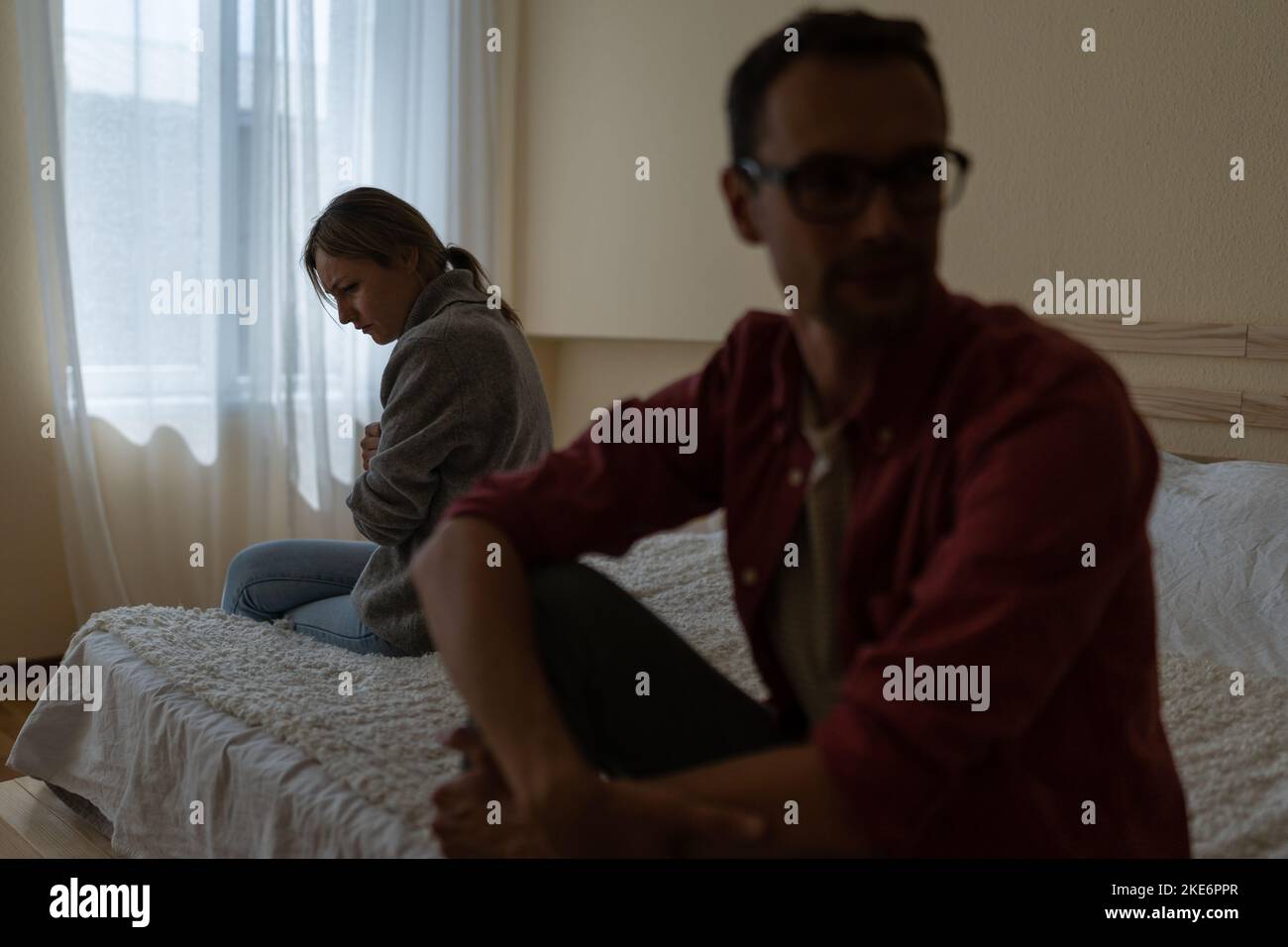 Unhappy family man and woman angry at each other for reasons ...