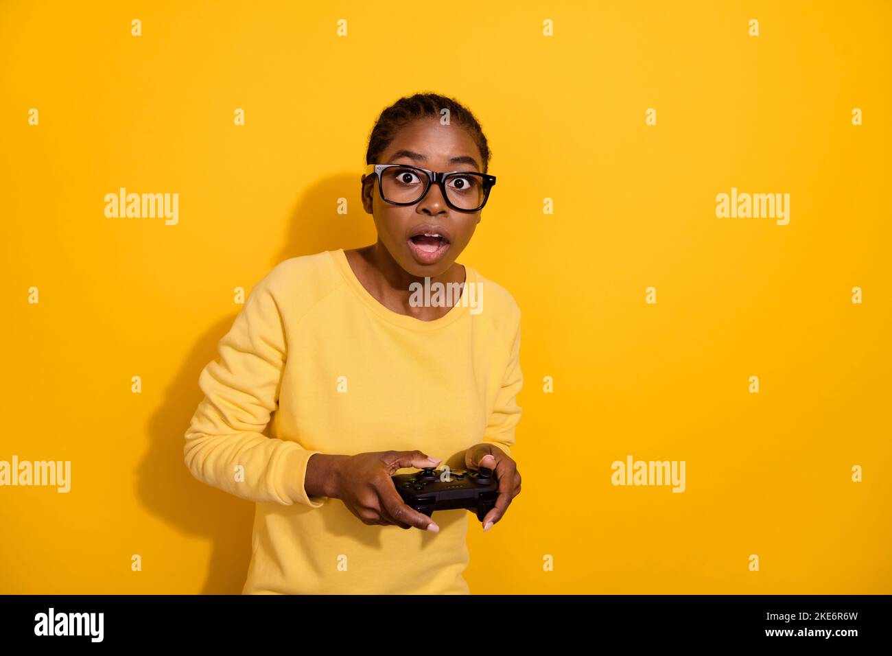 Portrait of attractive addicted worried girl playing video game copy ...