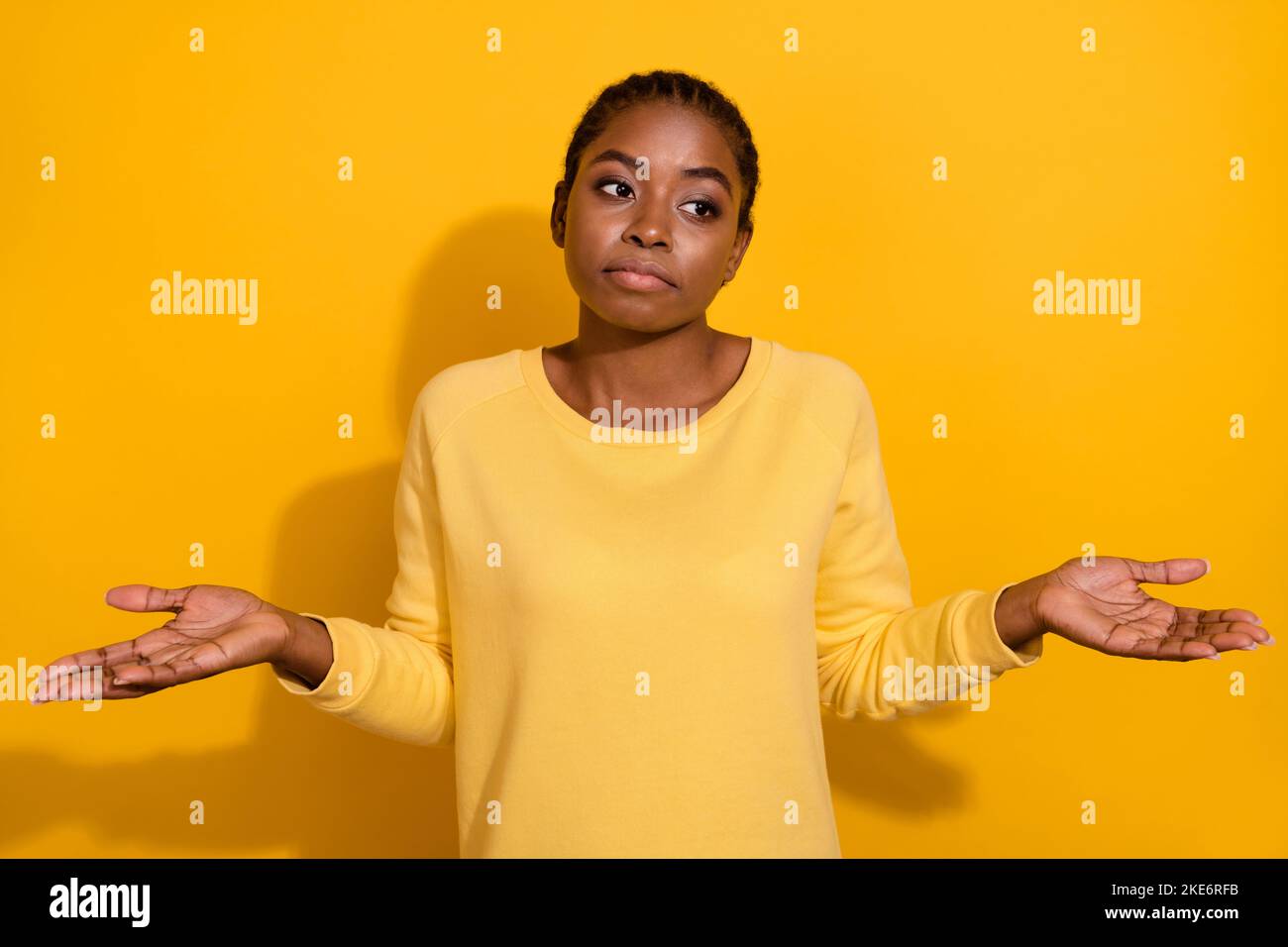 Portrait of attractive indifferent girl shrugging shoulders do not know ...