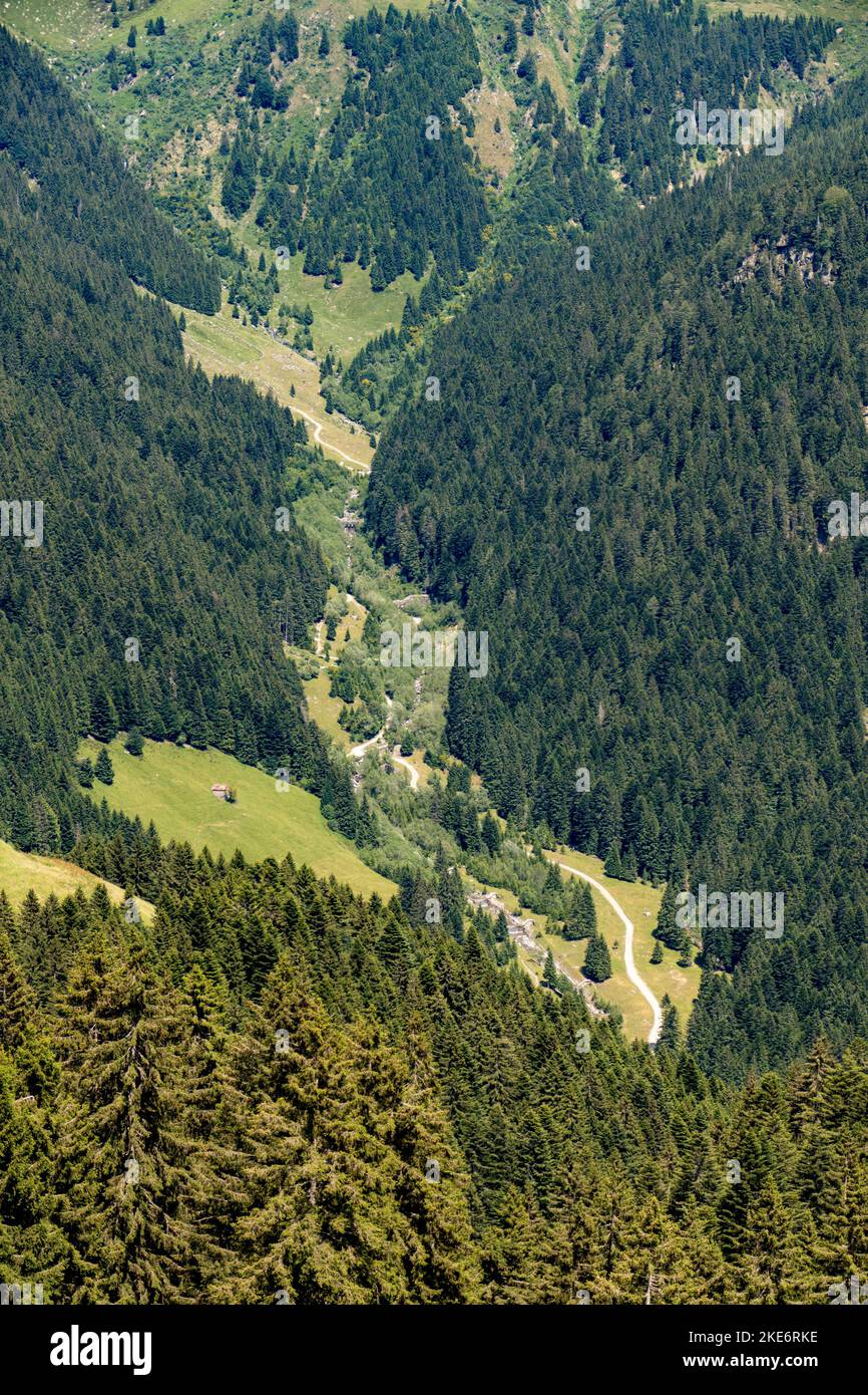 An aerial view of a alley in the middle of mountain hills Stock Photo ...