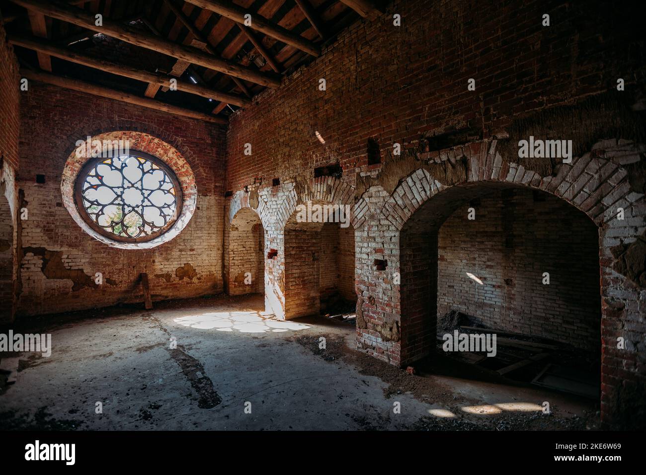 Round stained glass window in old abandoned castle Stock Photo - Alamy