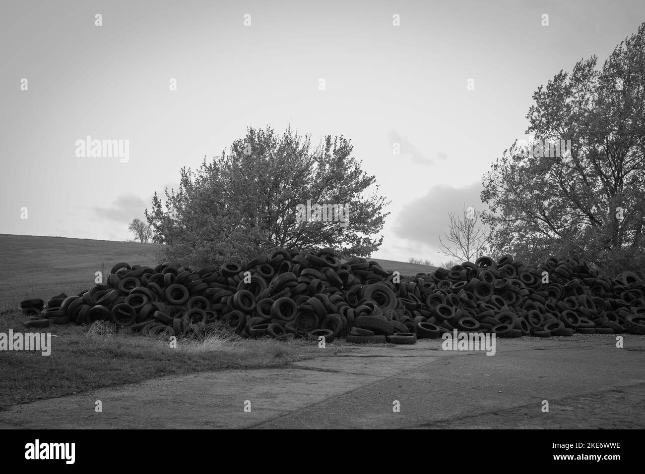on a square there are a lot of black car tires on a pile Stock Photo ...