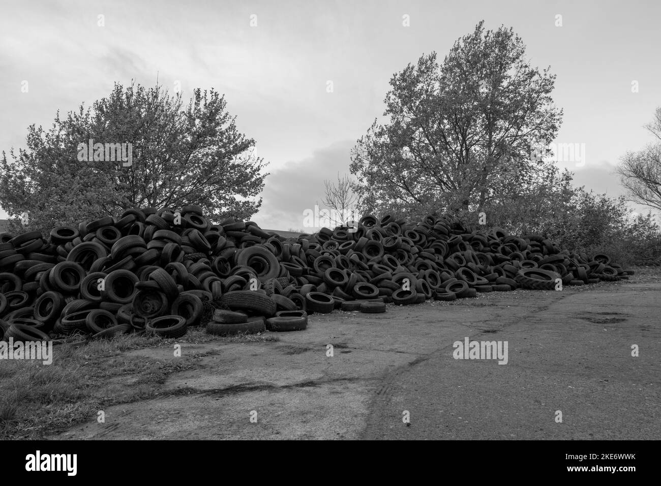 on a square there are a lot of black car tires on a pile Stock Photo ...