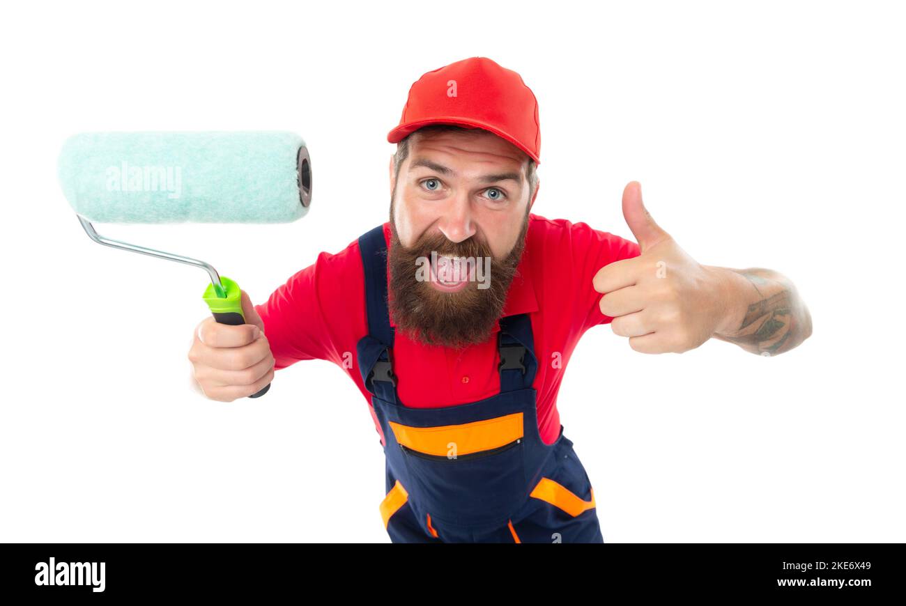 happy bearded man painter with paintroller in studio. man painter with ...