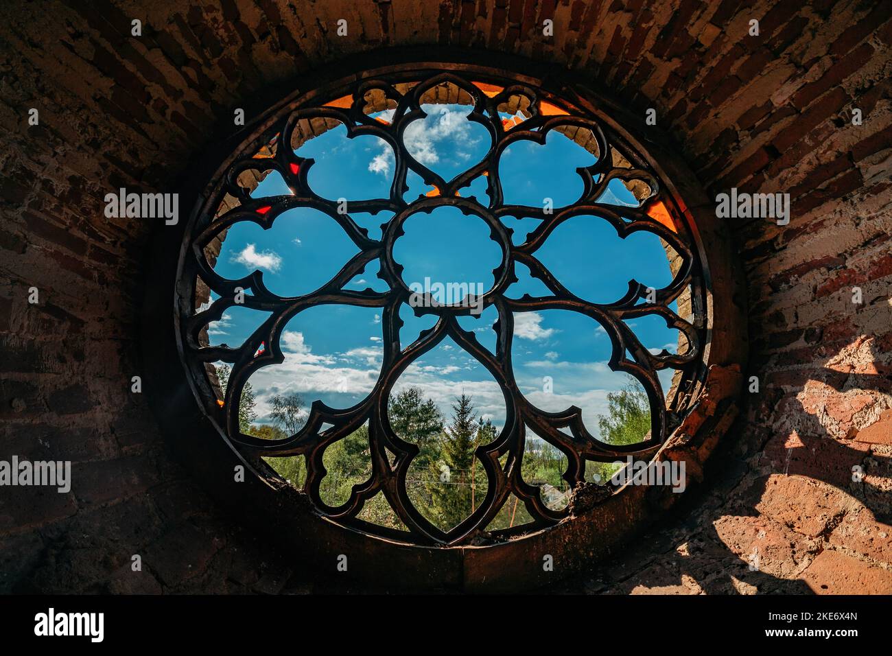 Round stained glass window in old abandoned castle Stock Photo - Alamy