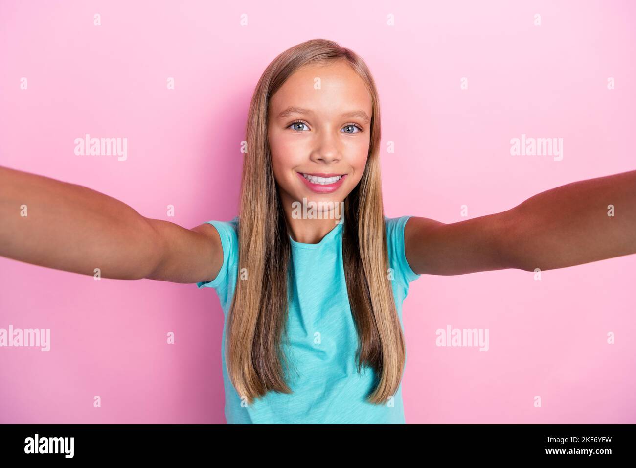 Photo of cheerful positive small kid wear turquoise t-shirt dark ...