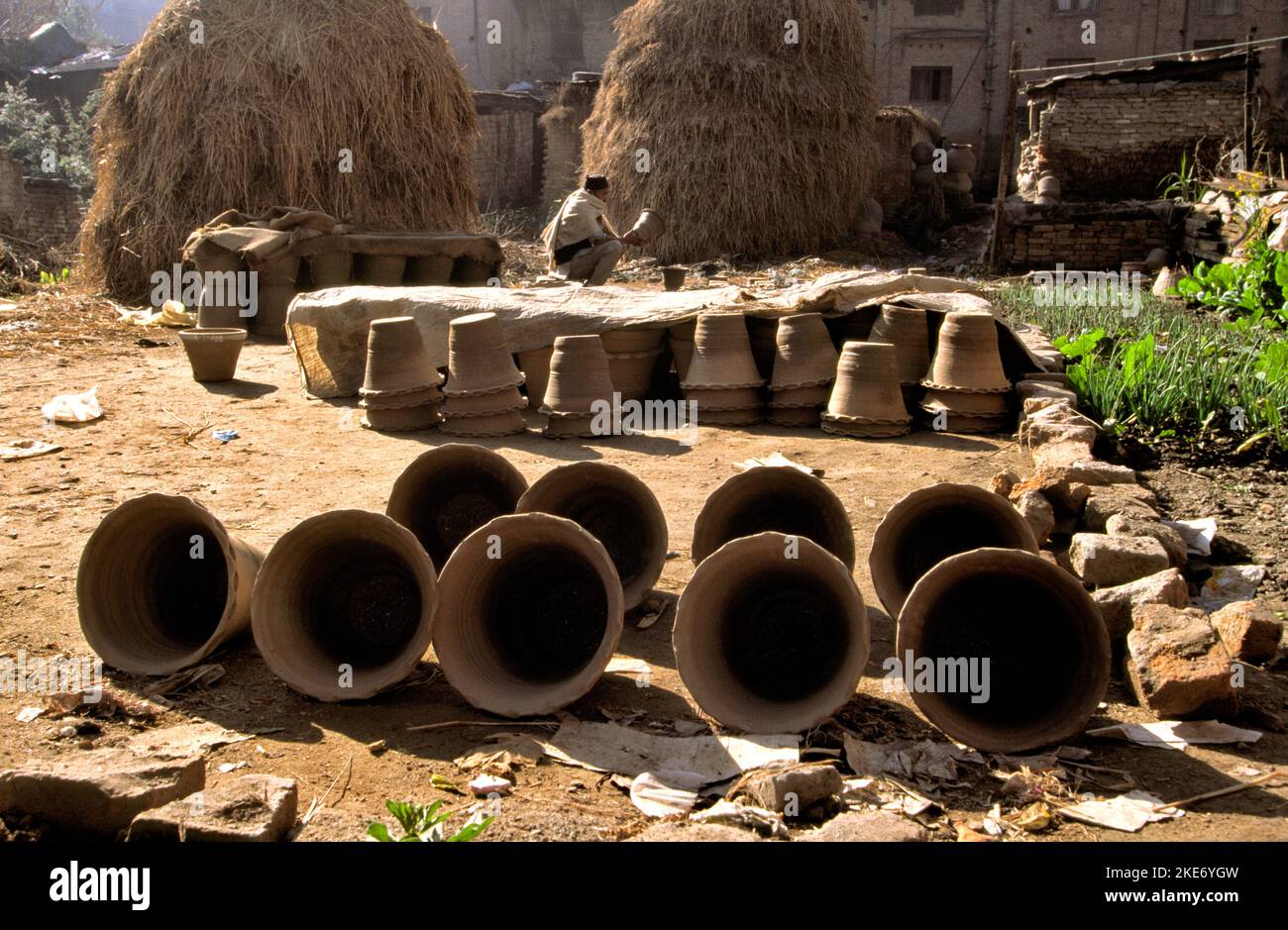 Nepal, Thimi, crafts, large pots drying before firing Stock Photo - Alamy