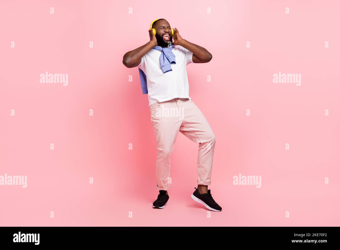 Full body image of active guy have fun dancing in nightclub listen ...