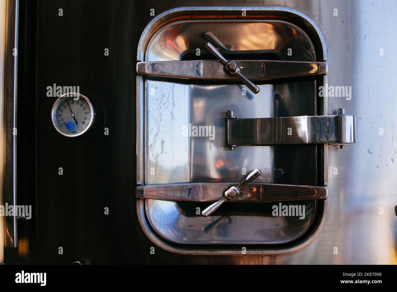 Thermometer or pressure gauge on fermentation vat in modern winery ...