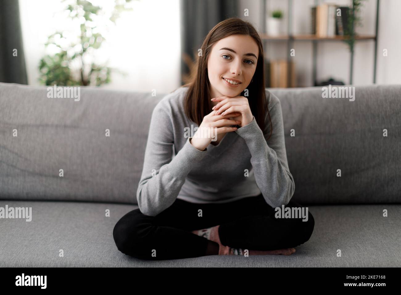 Woman resting on couch Stock Photo - Alamy