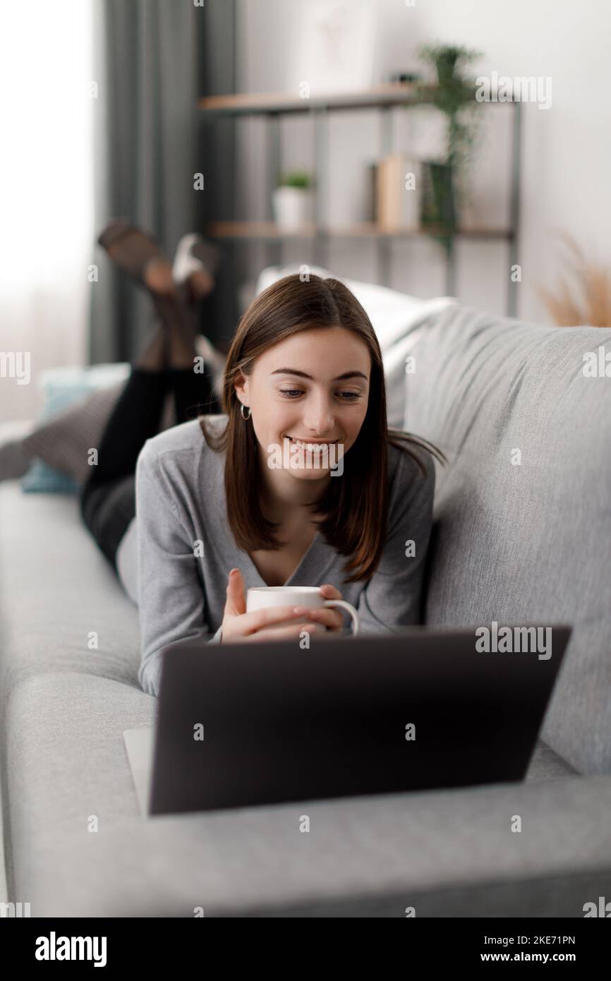 Woman lying down with drink hi-res stock photography and images - Alamy