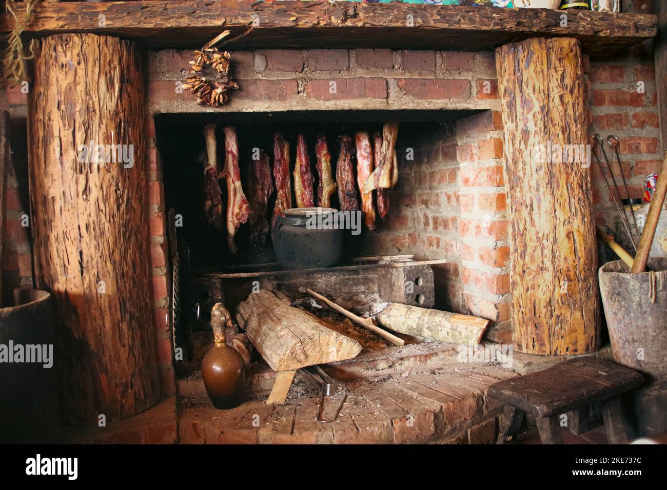 Smoked meat hanged on a stone fireplace, a common practice in the North ...