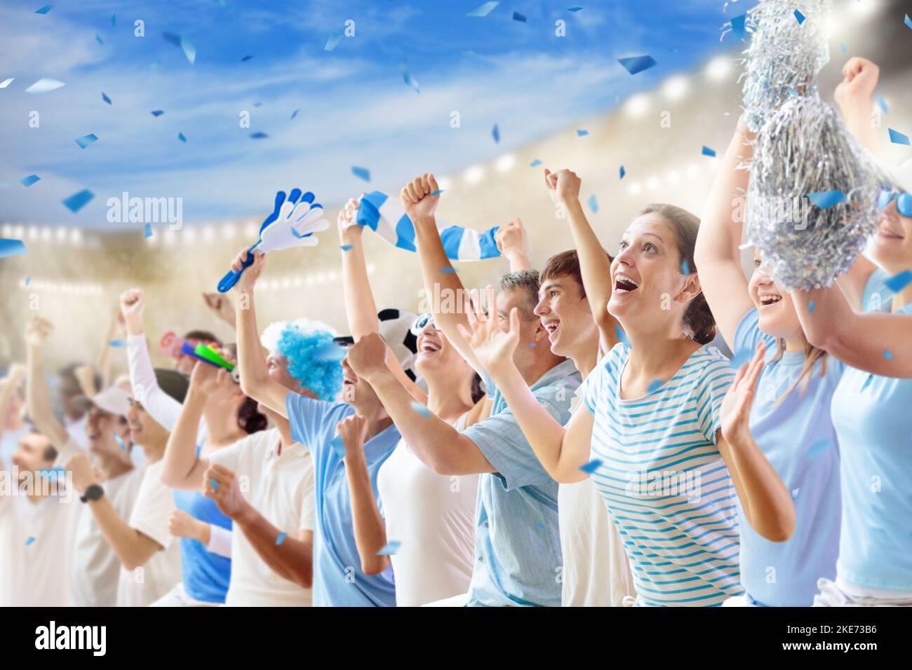 Football supporter on stadium in blue and white shirt. Happy fans on ...