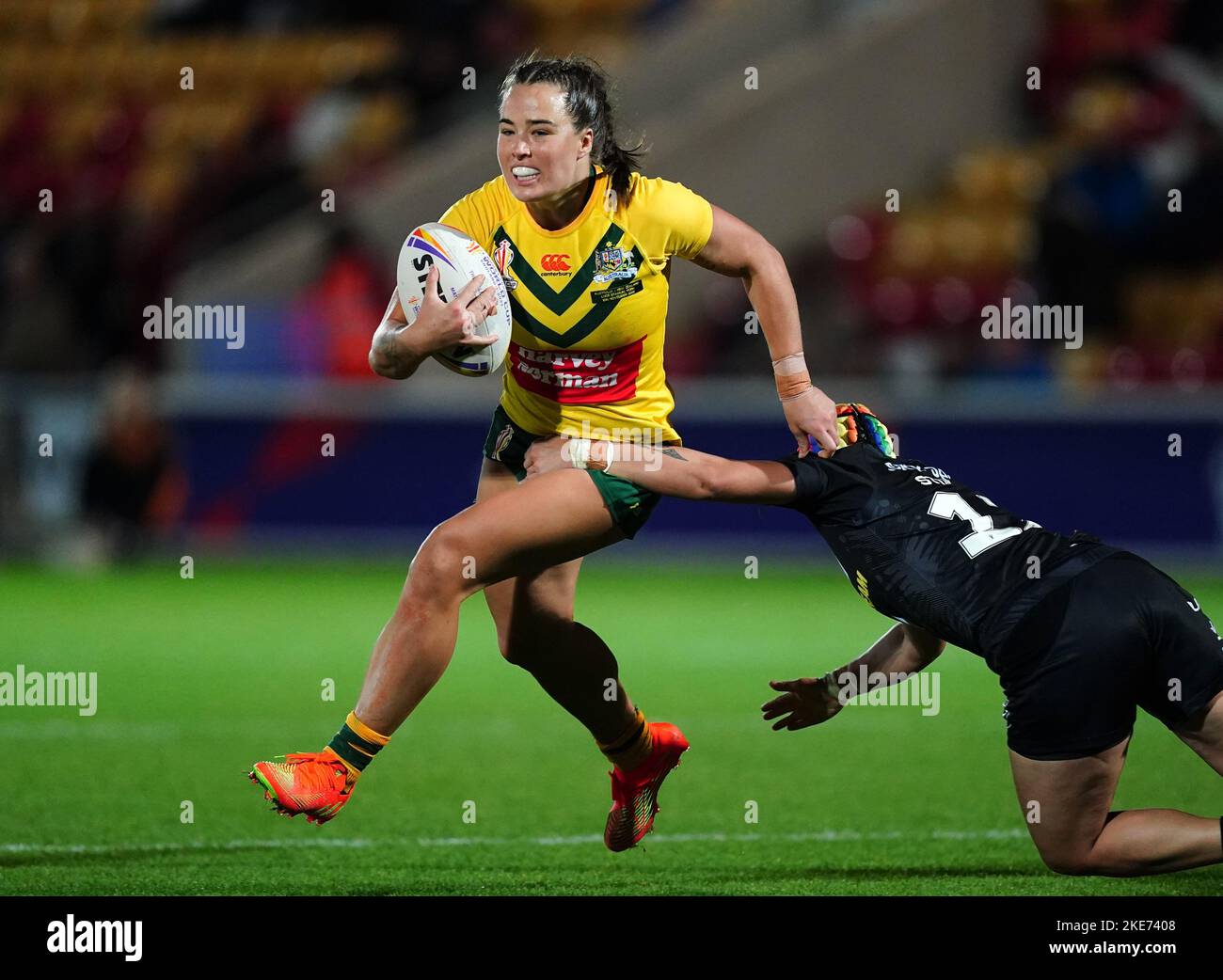 Australia's Isabelle Kelly is tackled by New Zealand's Christyl Stowers ...