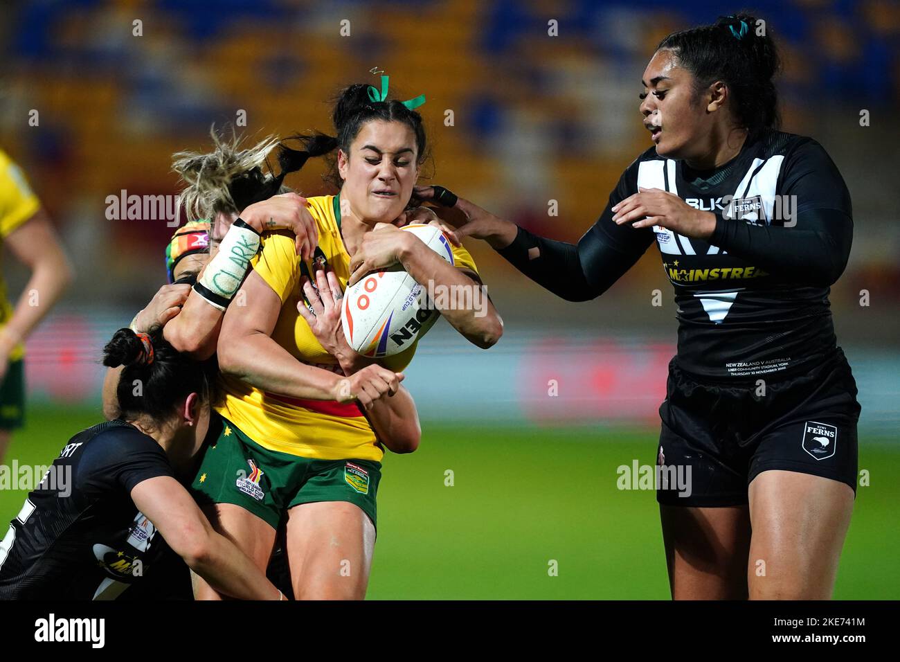 Australia's Yasmin Clydesdale is tackled by New Zealand's Brianna Clark ...