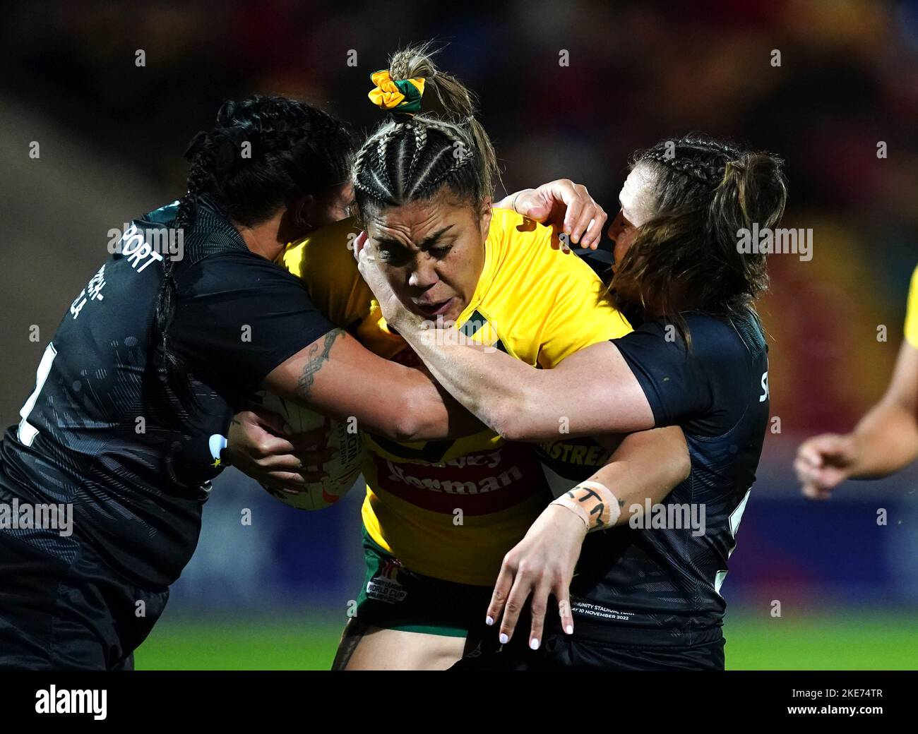 Australia's Shannon Mato is tackled by New Zealand's Georgia Hale and ...