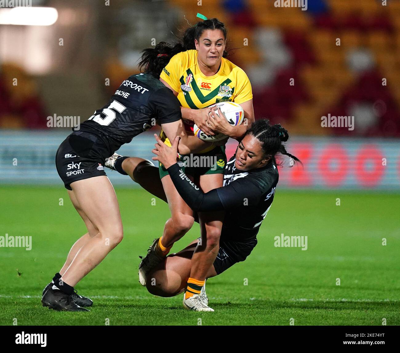 Australia's Yasmin Clydesdale is tackled by New Zealand's Abigail ...