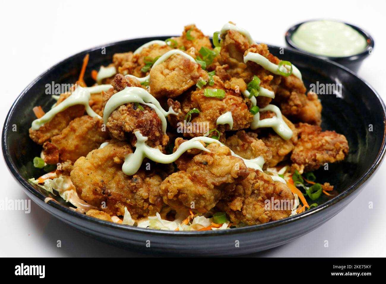 crispy fried chicken bites with white background Stock Photo - Alamy